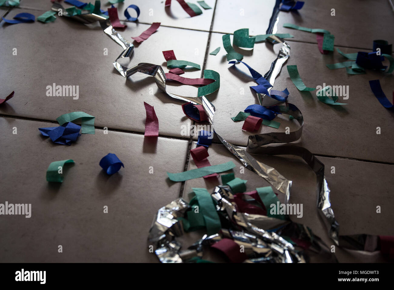 Colorful confetti paper on the floor - Cold atmosphere Stock Photo - Alamy