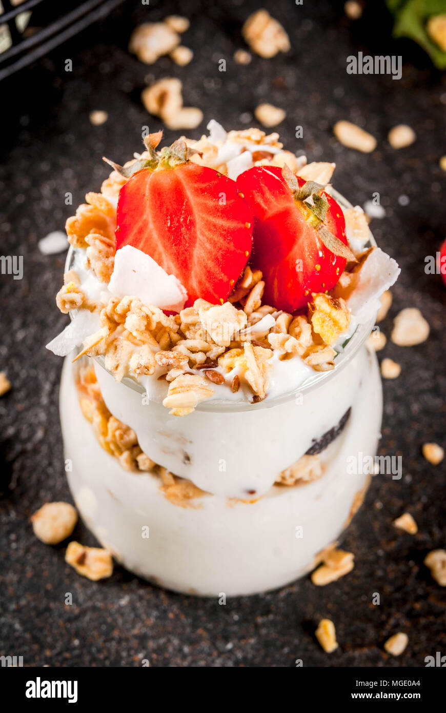 Healthy summer breakfast idea, homemade layered parfe dessert in small ...