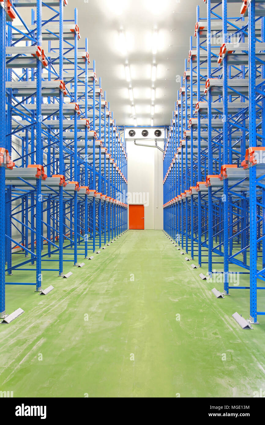 Refrigerated and freezing warehouse with blue shelves Stock Photo - Alamy