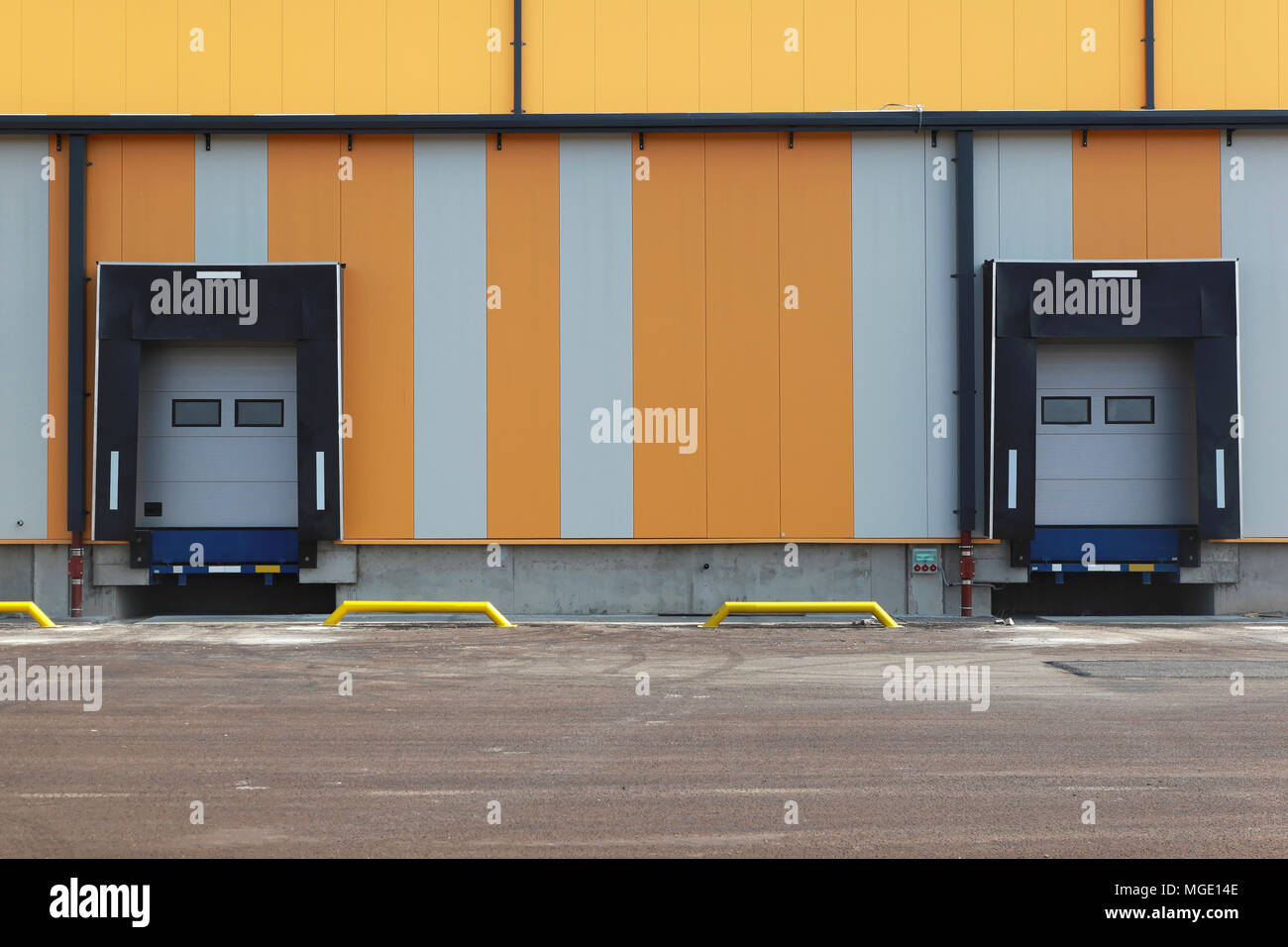 Two ramps for loading trucks at distribution warehouse Stock Photo - Alamy