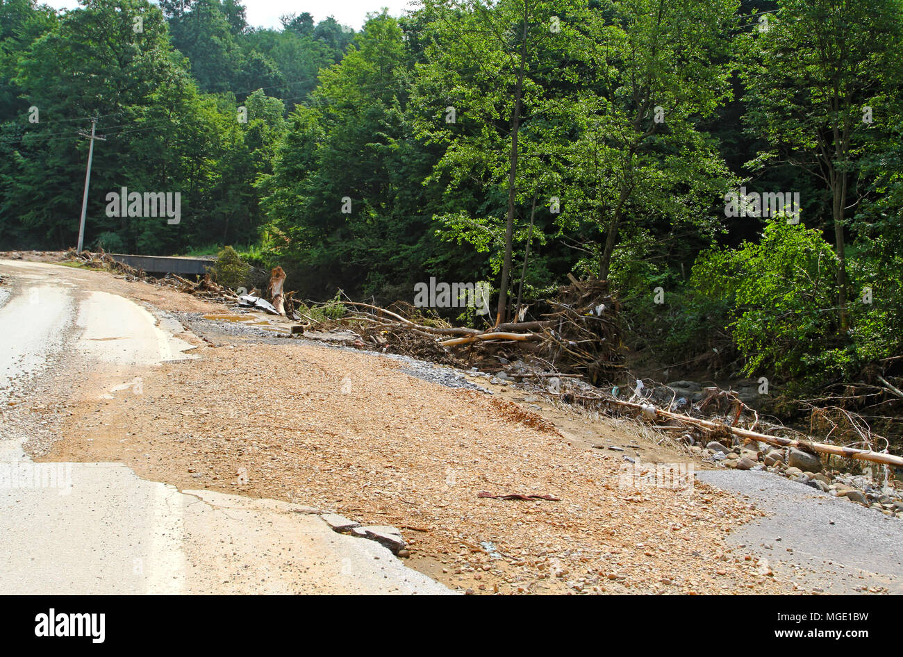 Damaged road after natural disaster of flooding Stock Photo - Alamy