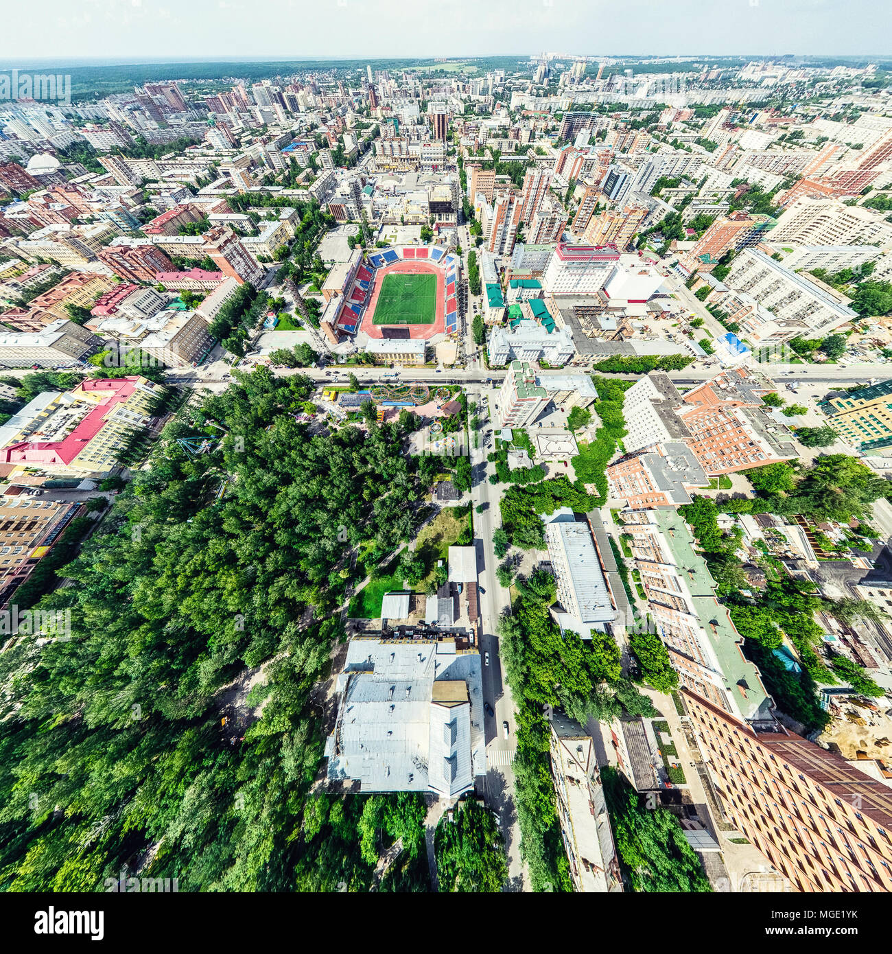 Aerial city view with crossroads and roads, houses, buildings, parks ...
