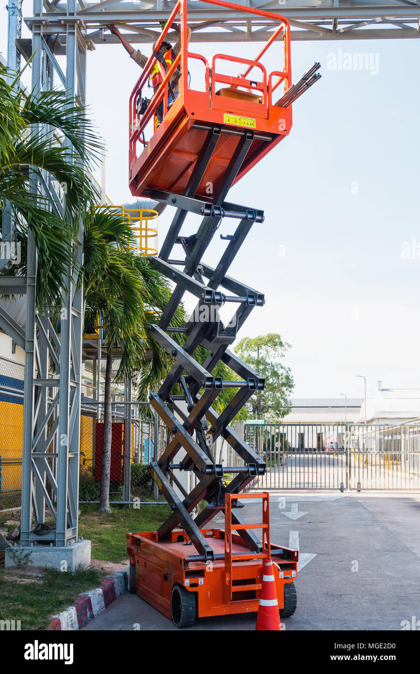 Scissor lift platform and electrical technician operated wiring Stock ...