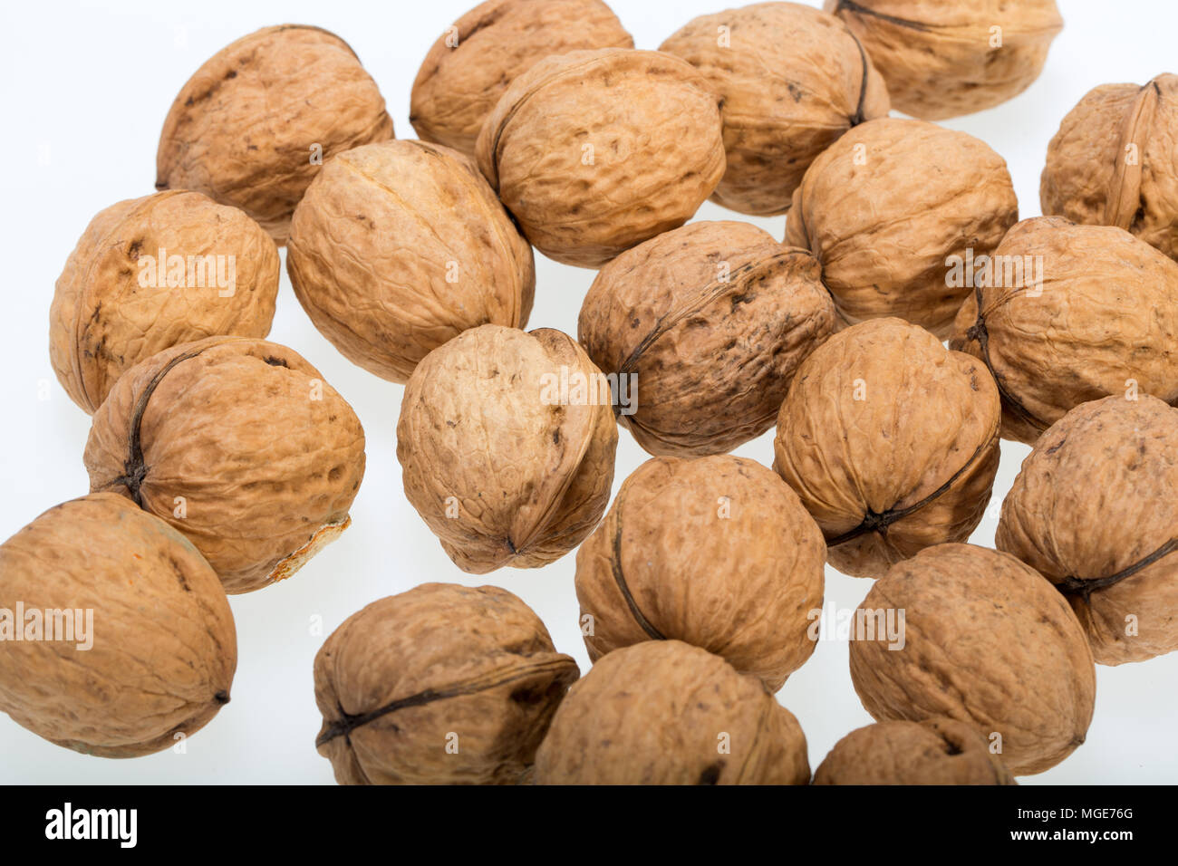 walnuts heap isolated on white background Stock Photo - Alamy