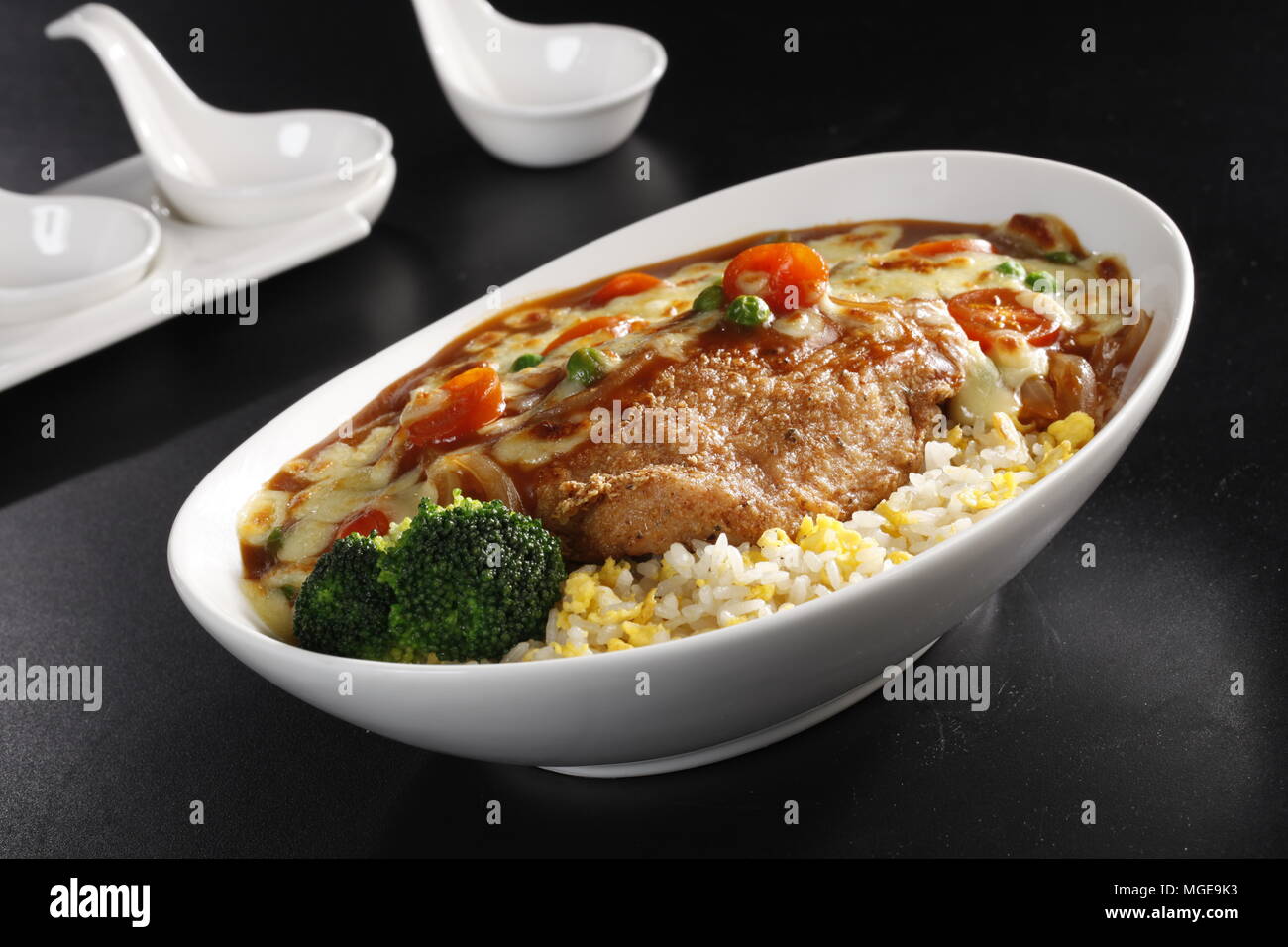 pork chop over rice Stock Photo - Alamy