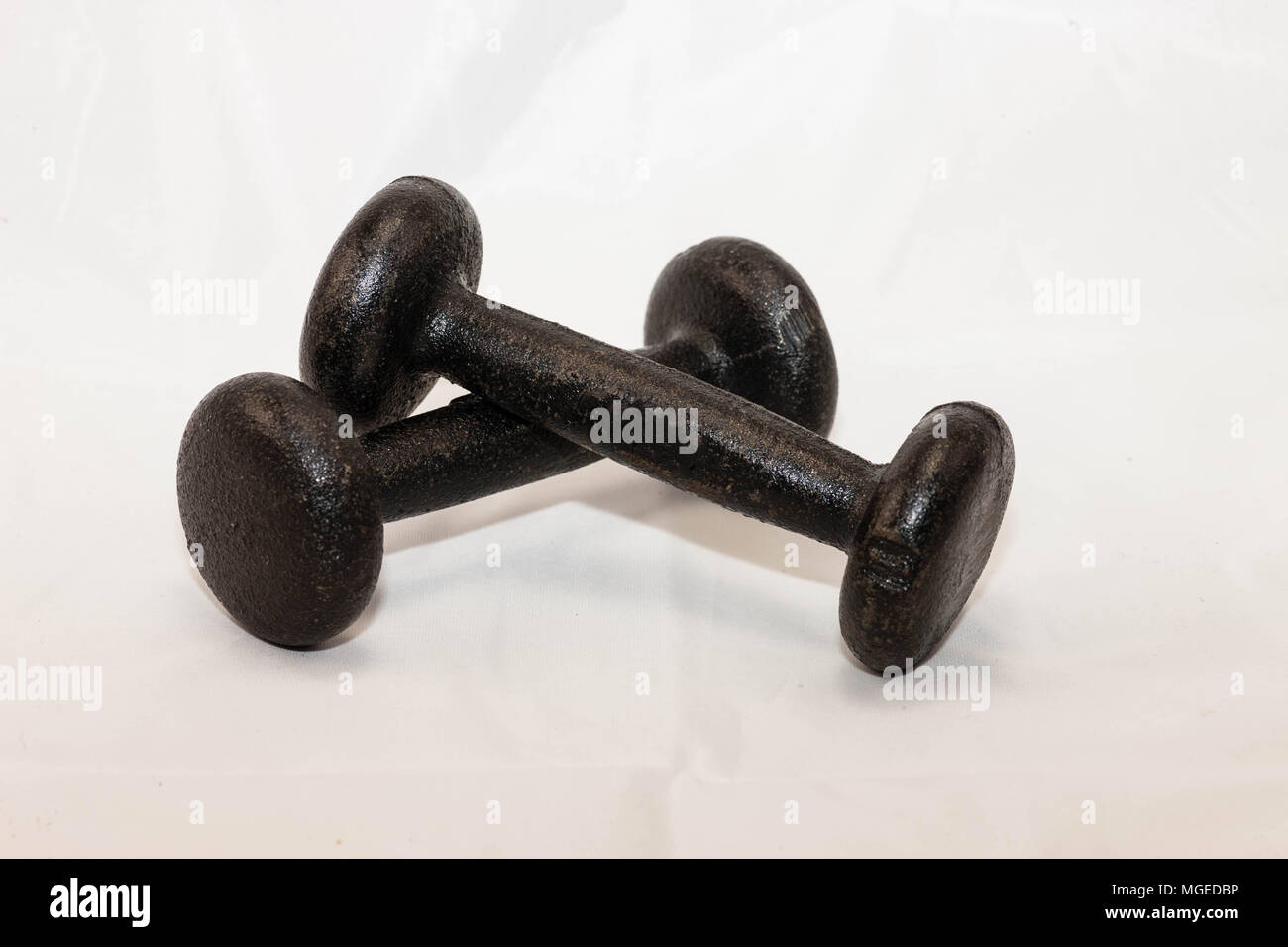 small two pound black metal hand weights for exercise Stock Photo - Alamy