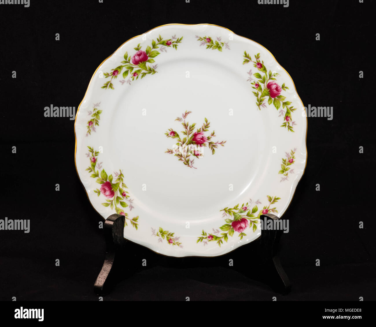 a hand painted rose pattern china dinner plate Stock Photo - Alamy