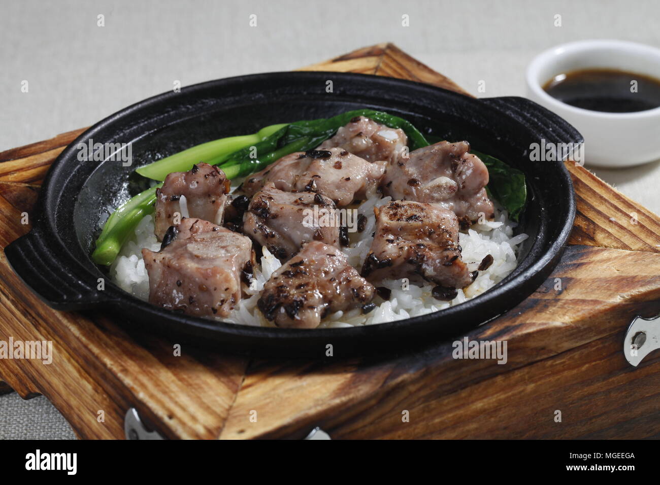 pork chop over rice Stock Photo - Alamy