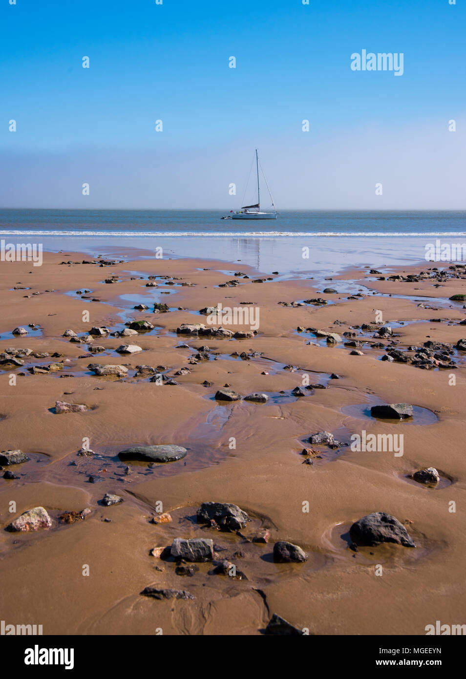 Yacht moored off Pwlldu Bay, Gower, South Wales, UK Stock Photo - Alamy