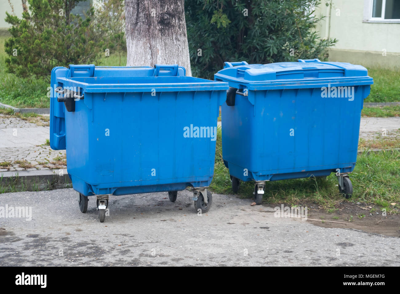 Big blue recycling containers on the street Stock Photo - Alamy