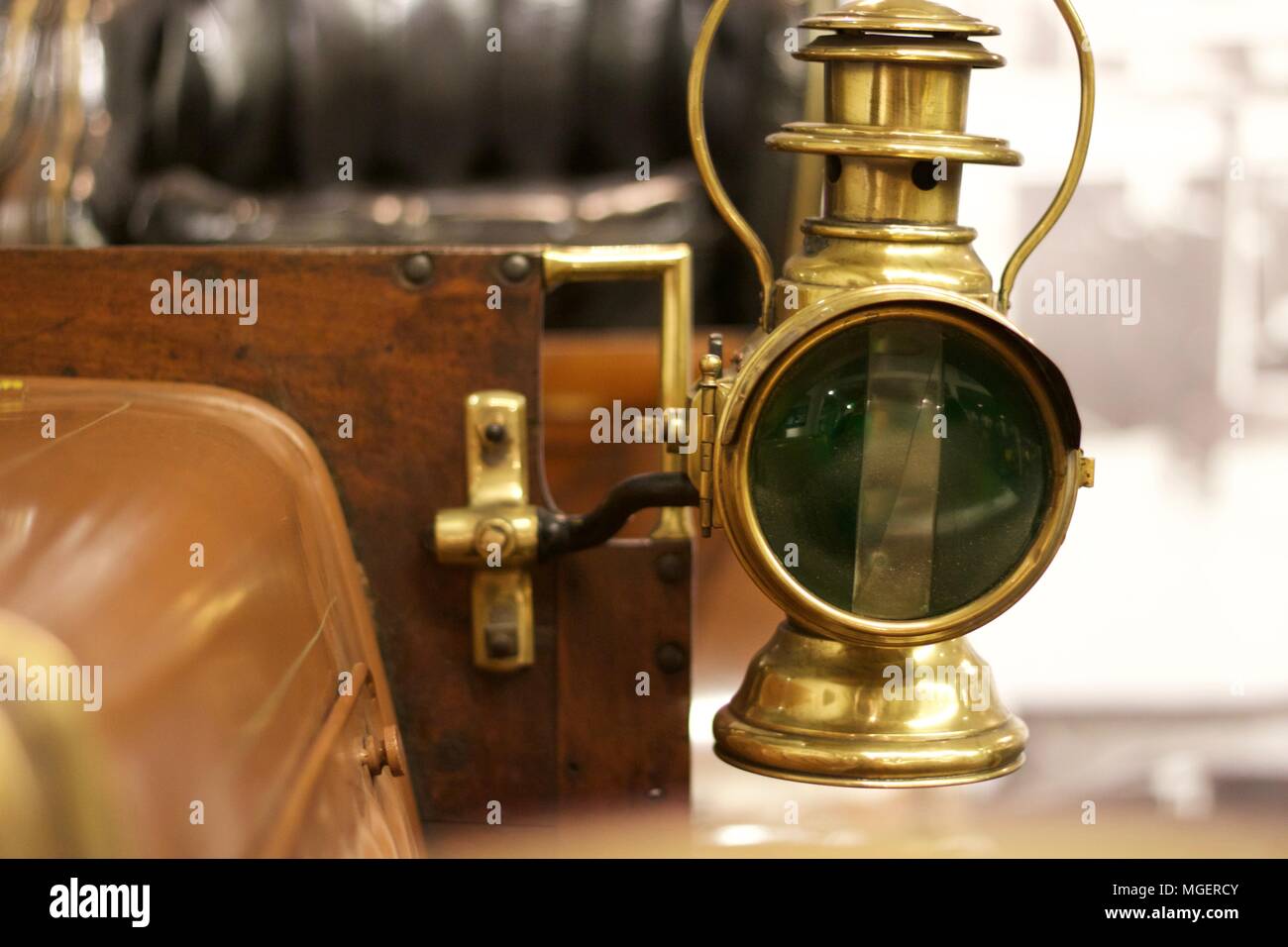 Old golden lighthouse of a vintage wooden car produced at the beginning ...