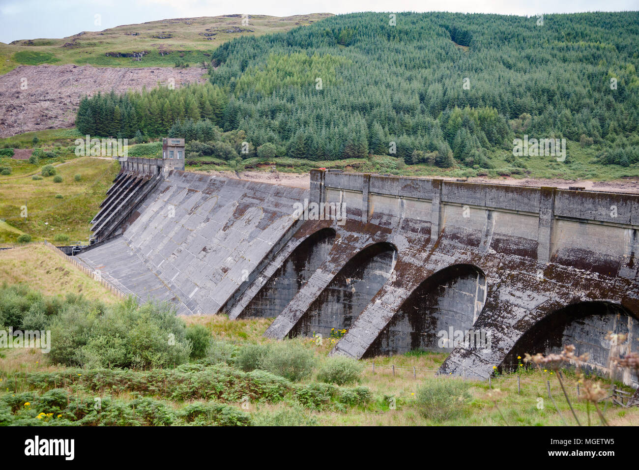Dam on freshwater Loch Tarsan lake used as impounding reservoir ...