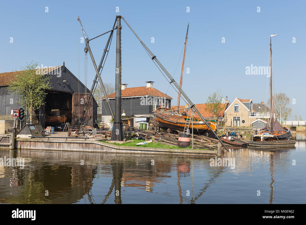 Historical ships at shipyard with slipway in Dutch village Workum Stock ...