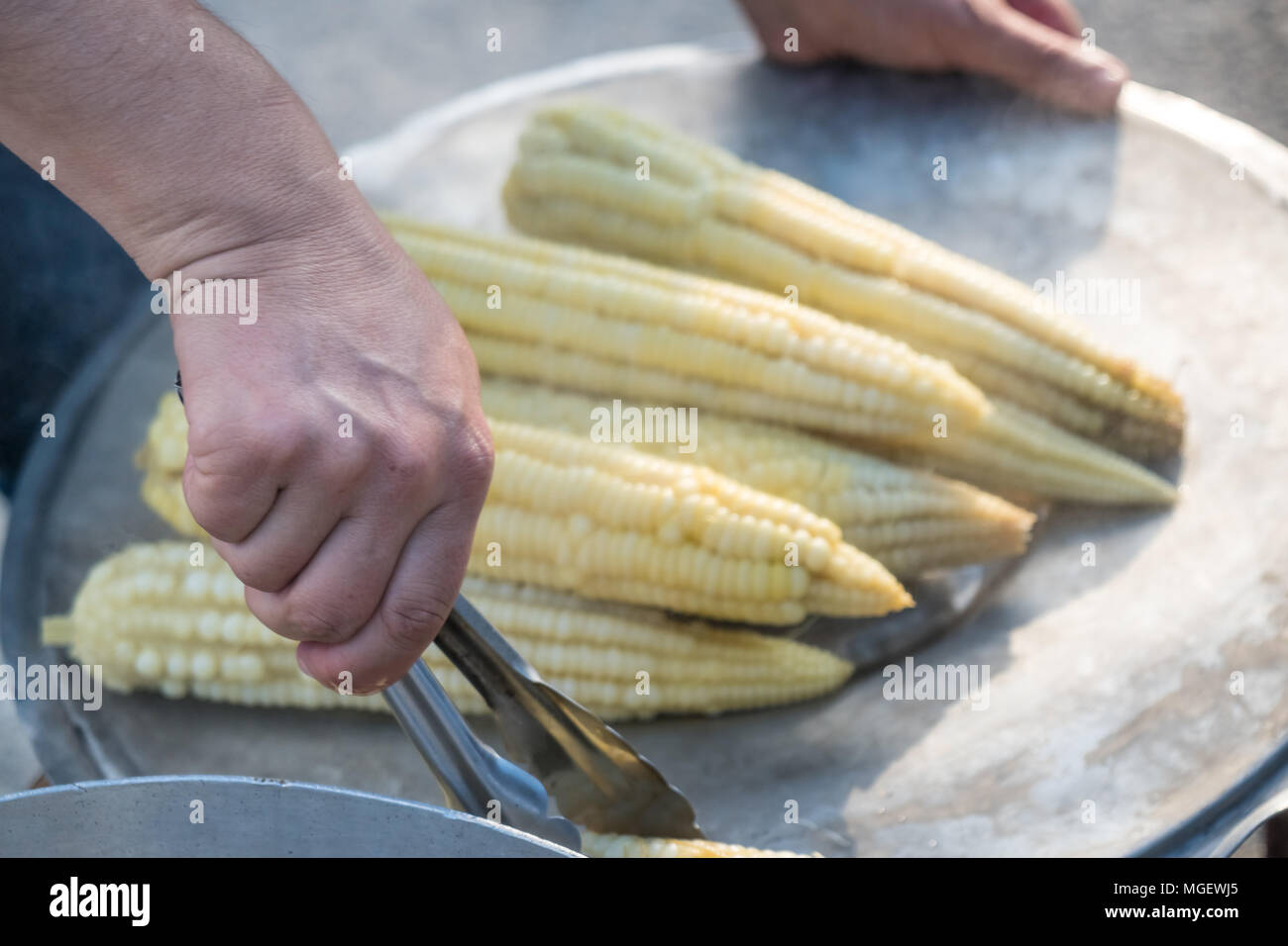 Boiled fresh white corn at street food Stock Photo - Alamy
