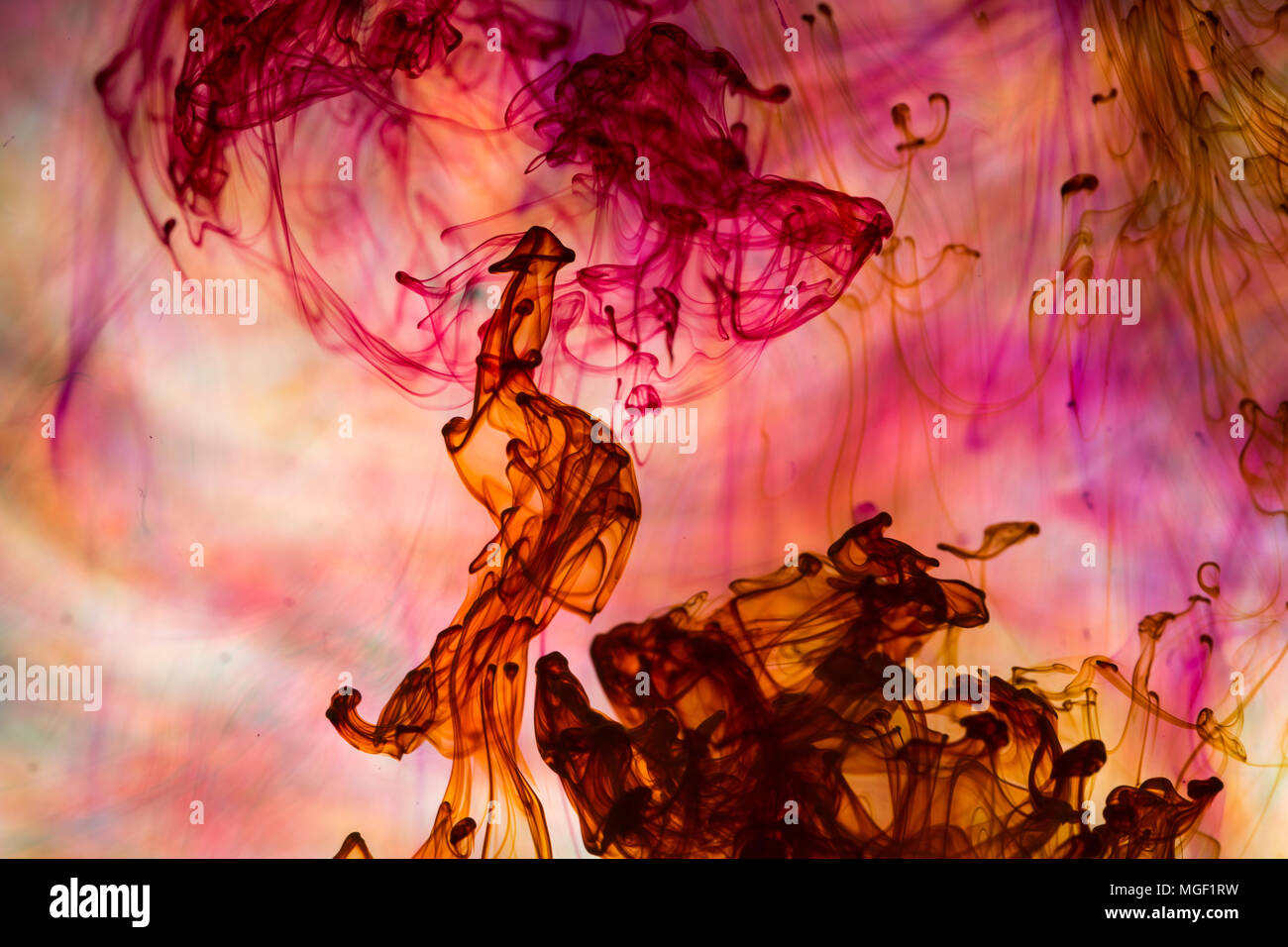 Acrylic colors and ink in water. Abstract background Stock Photo - Alamy