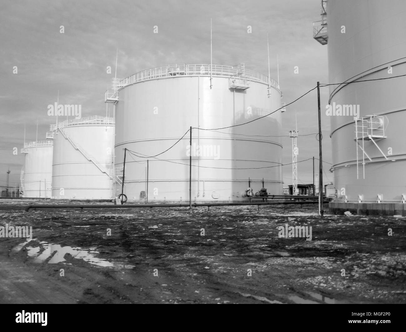 Crude oil gas storage tanks Black and White Stock Photos & Images - Alamy