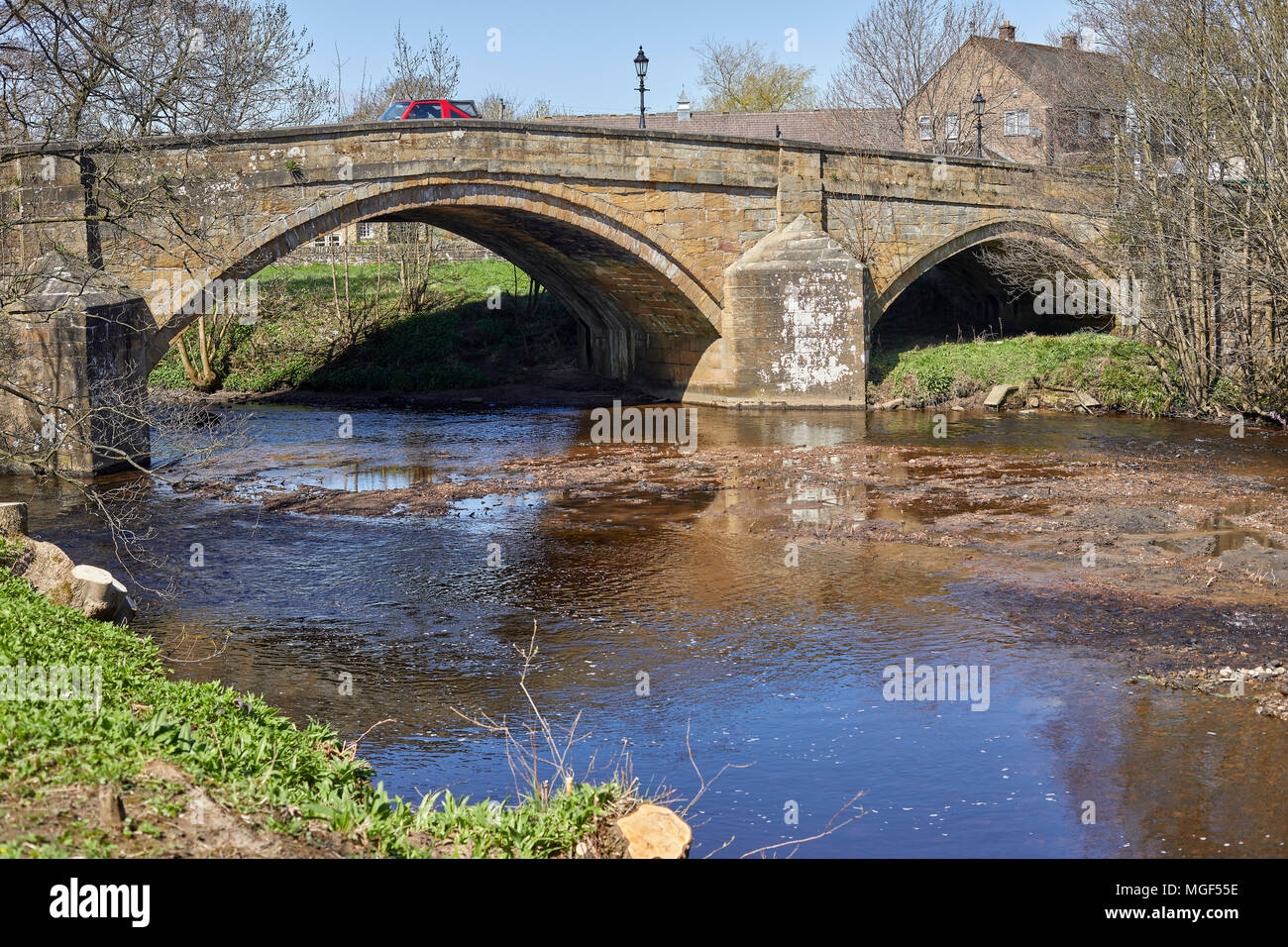 3 arched bridge over the river Nidd after clearance of natural build up ...