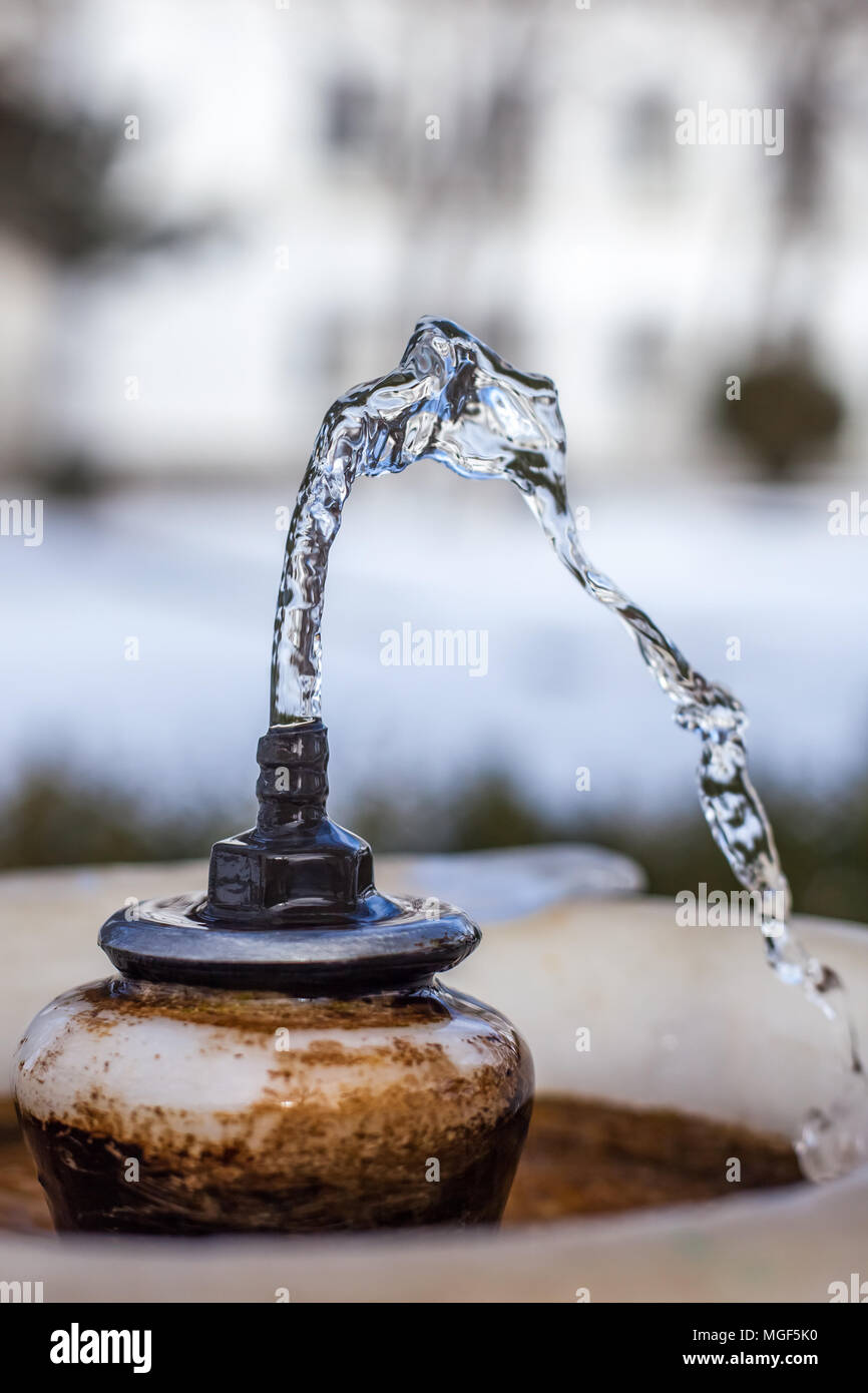 Close up water drops flowing from fountain Stock Photo - Alamy
