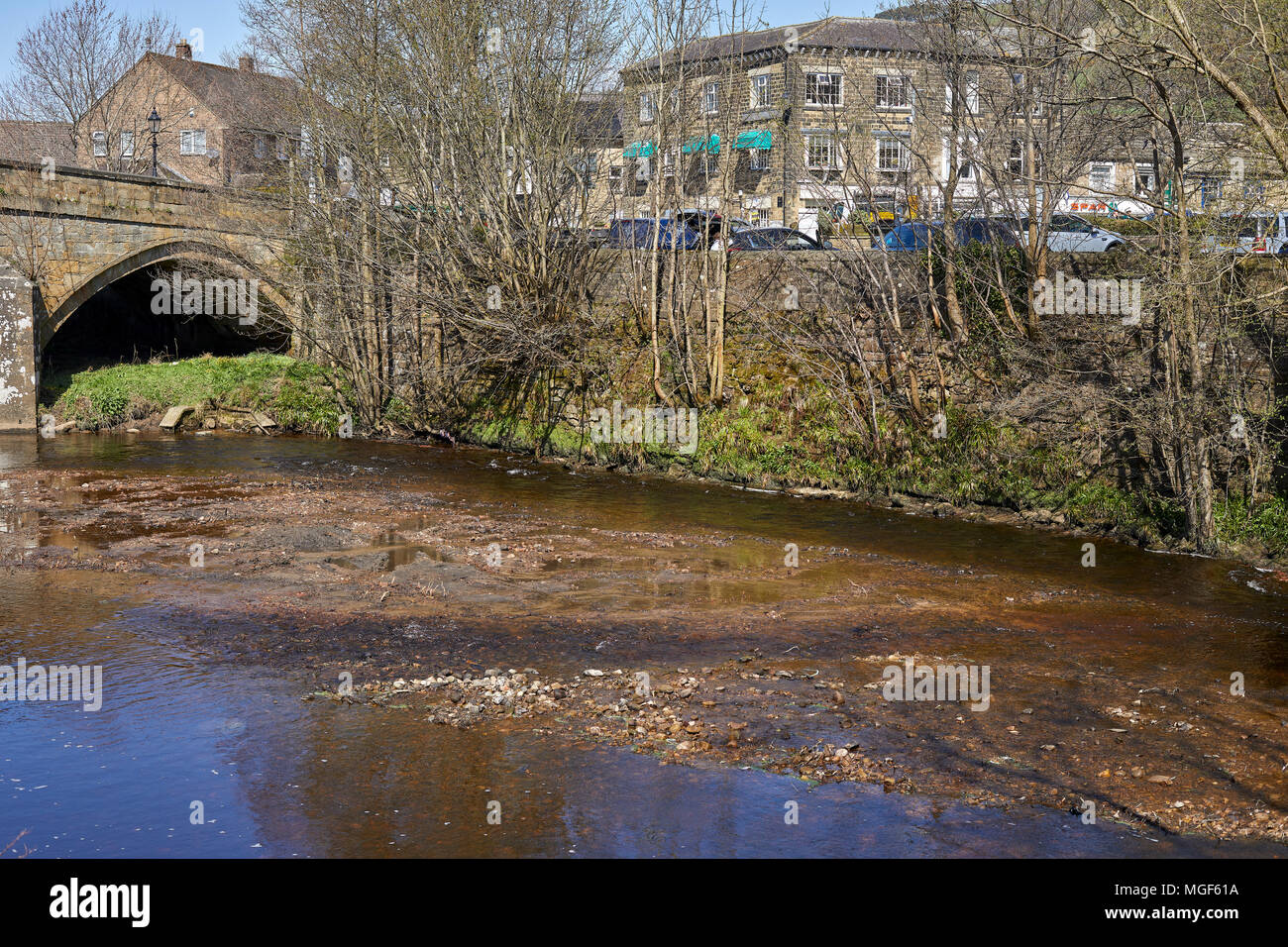3 arched bridge over the river Nidd after clearance of natural build up ...