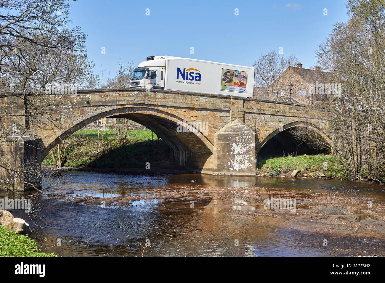 3 arched bridge over the river Nidd after clearance of natural build up ...