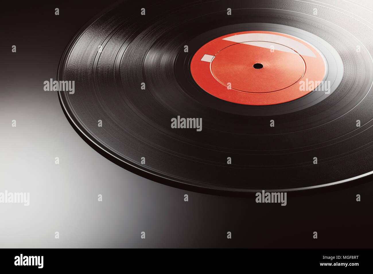 Record LP with orange label on a reflective surface Stock Photo - Alamy
