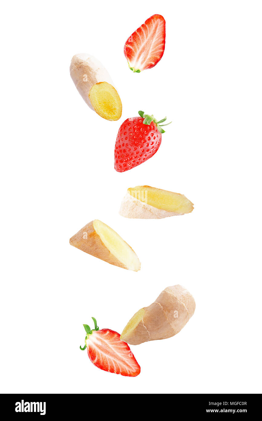 Isolated falling fruits. Flying sweet strawberry and ginger isolated on ...