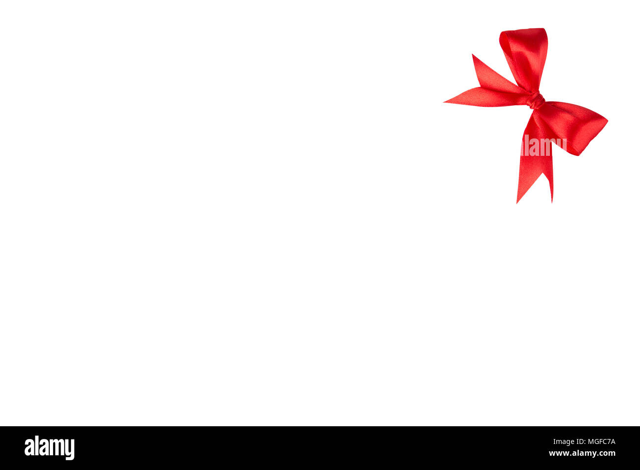 Red bow in the corner on the white background Stock Photo - Alamy