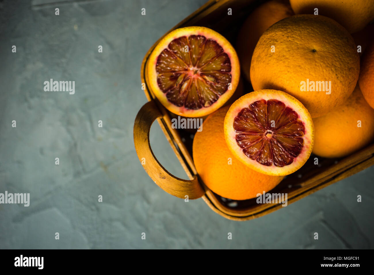 Vintage box full of organic red blood oranges on natural background ...