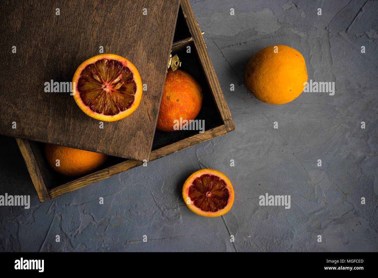Vintage box full of organic red blood oranges on natural background ...