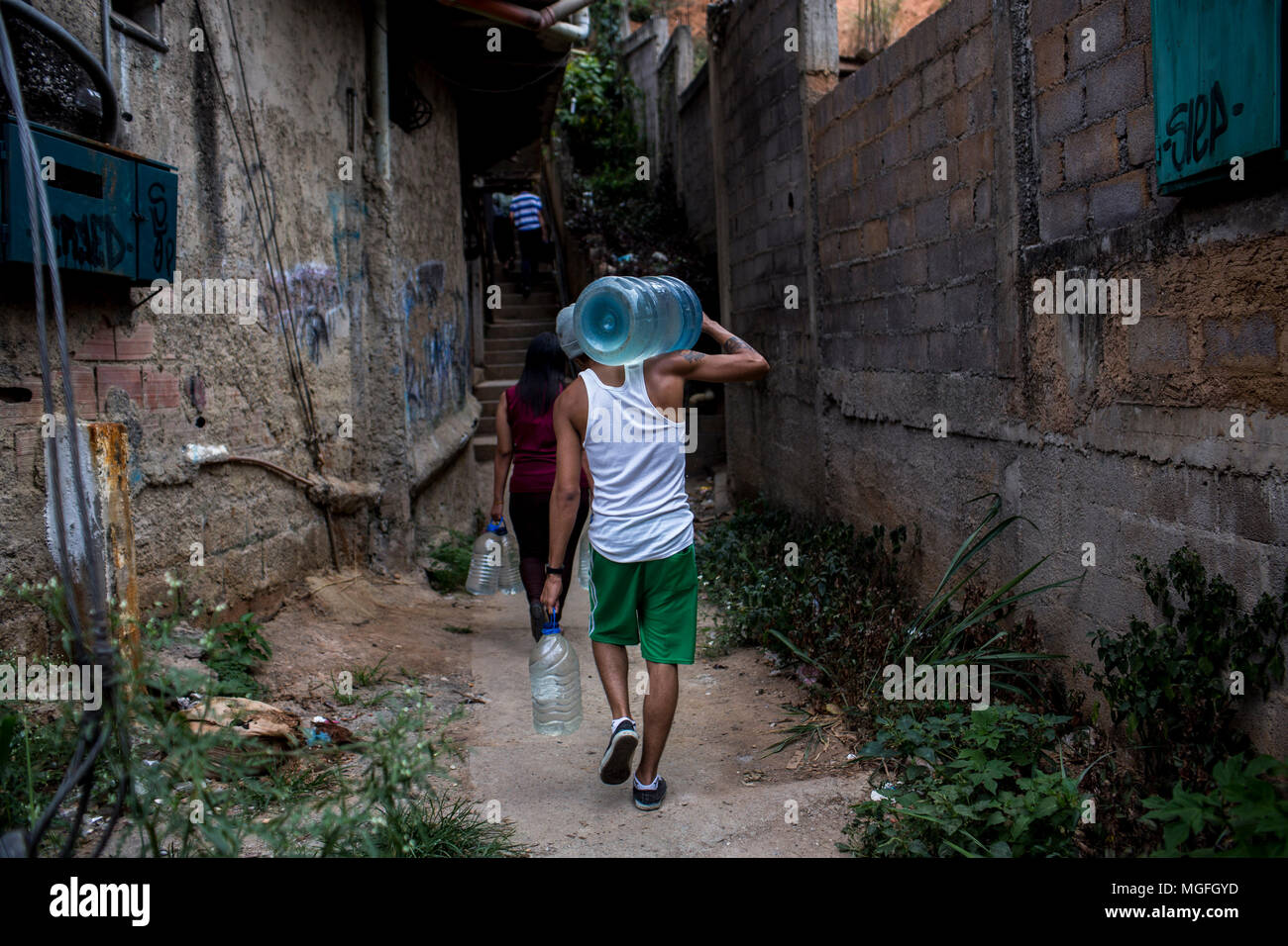 Man carrying water jug hi-res stock photography and images - Alamy
