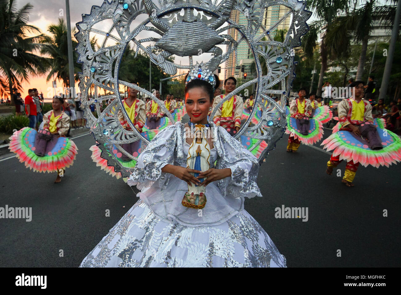 Philippines. 28th Apr, 2018. A festival queen holding a statue of the ...