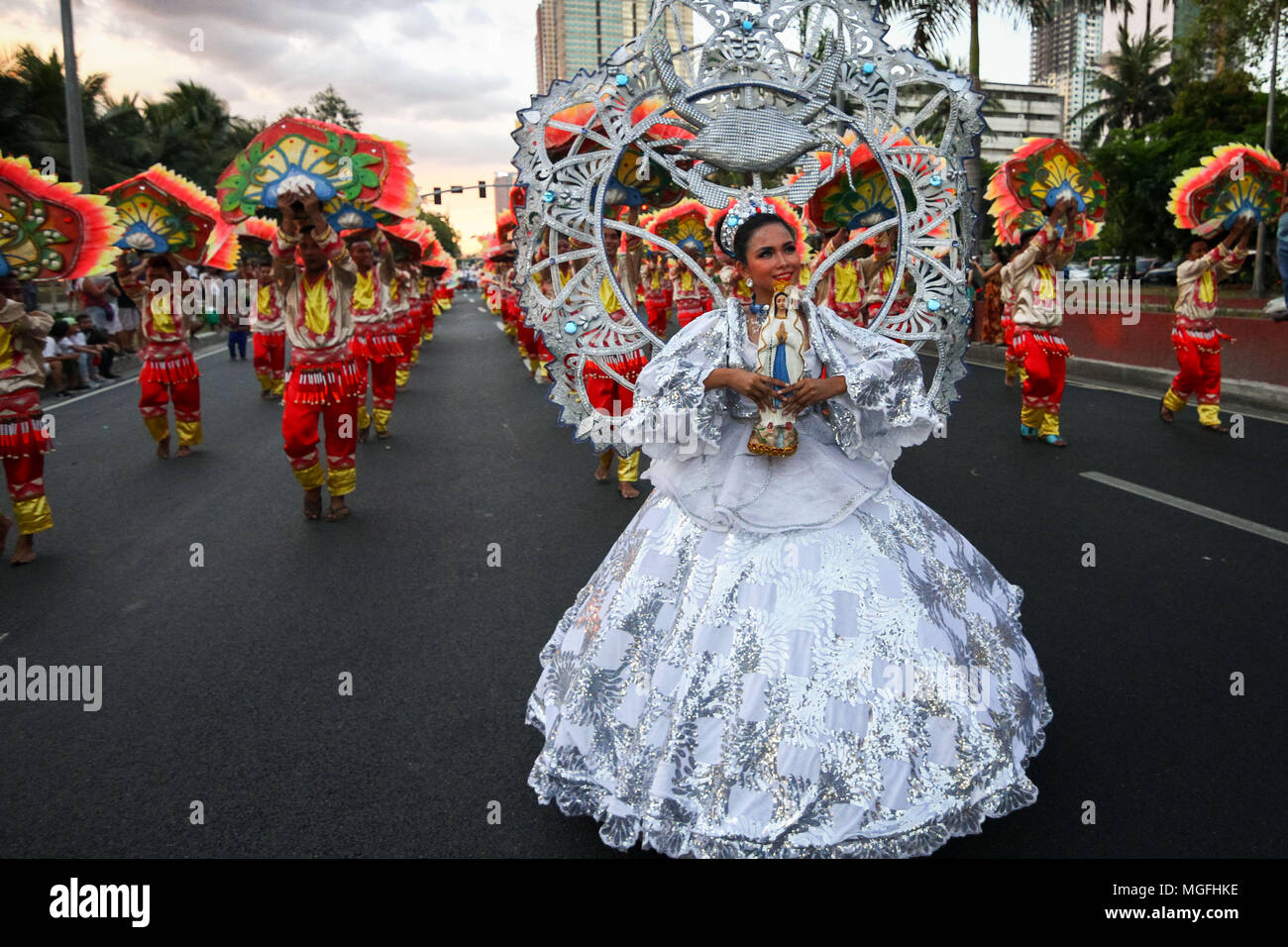 Philippines. 28th Apr, 2018. A festival queen holding a statue of the ...