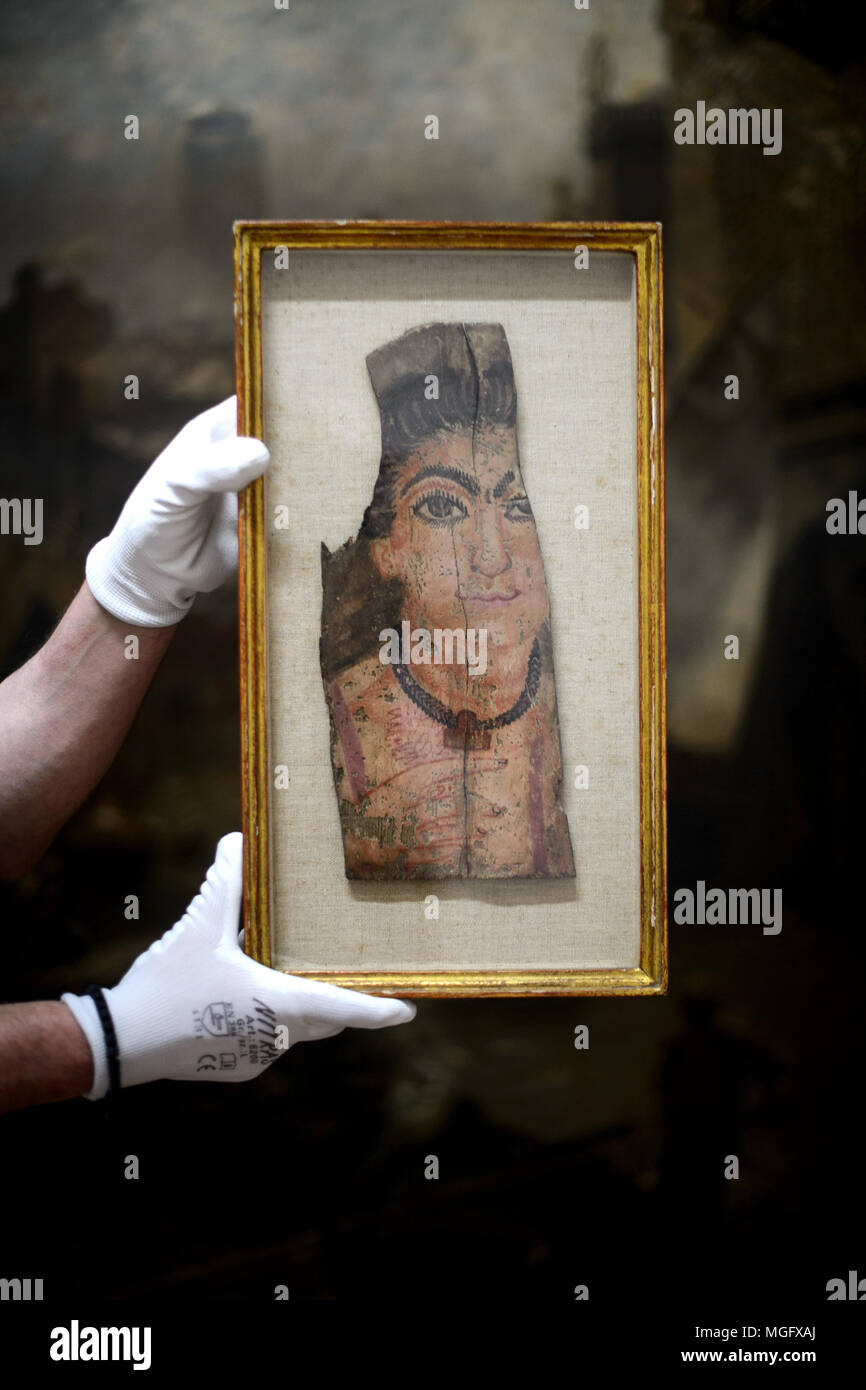 Stuttgart, Germany. 27 April 2018. A man holding the mummy portrait of ...