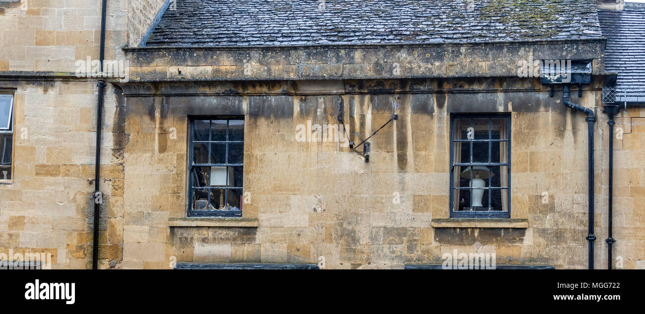 Cotswold limestone adorns the facade of this elegant terraced house in ...