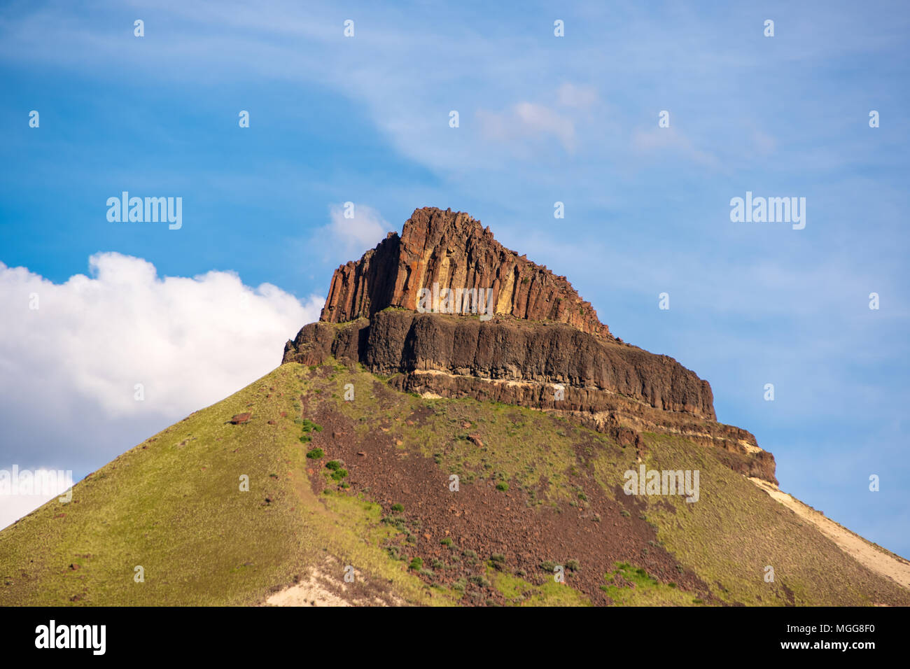 Sheep Rock as seen from Cant Ranch in Oregon. Claystone volcanic ash ...