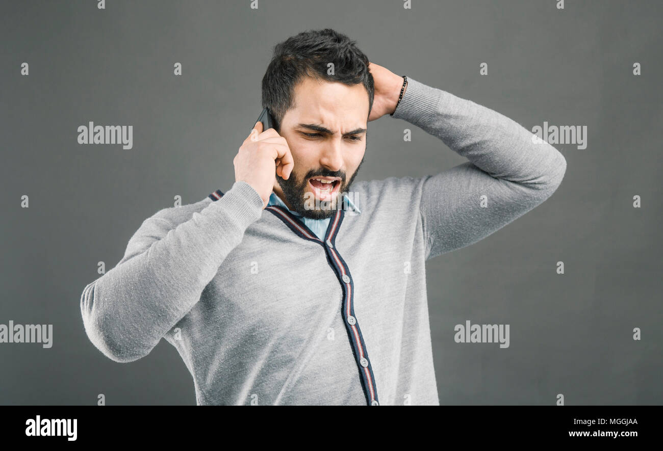 Angry guy shouting mobile phone hi-res stock photography and images - Alamy