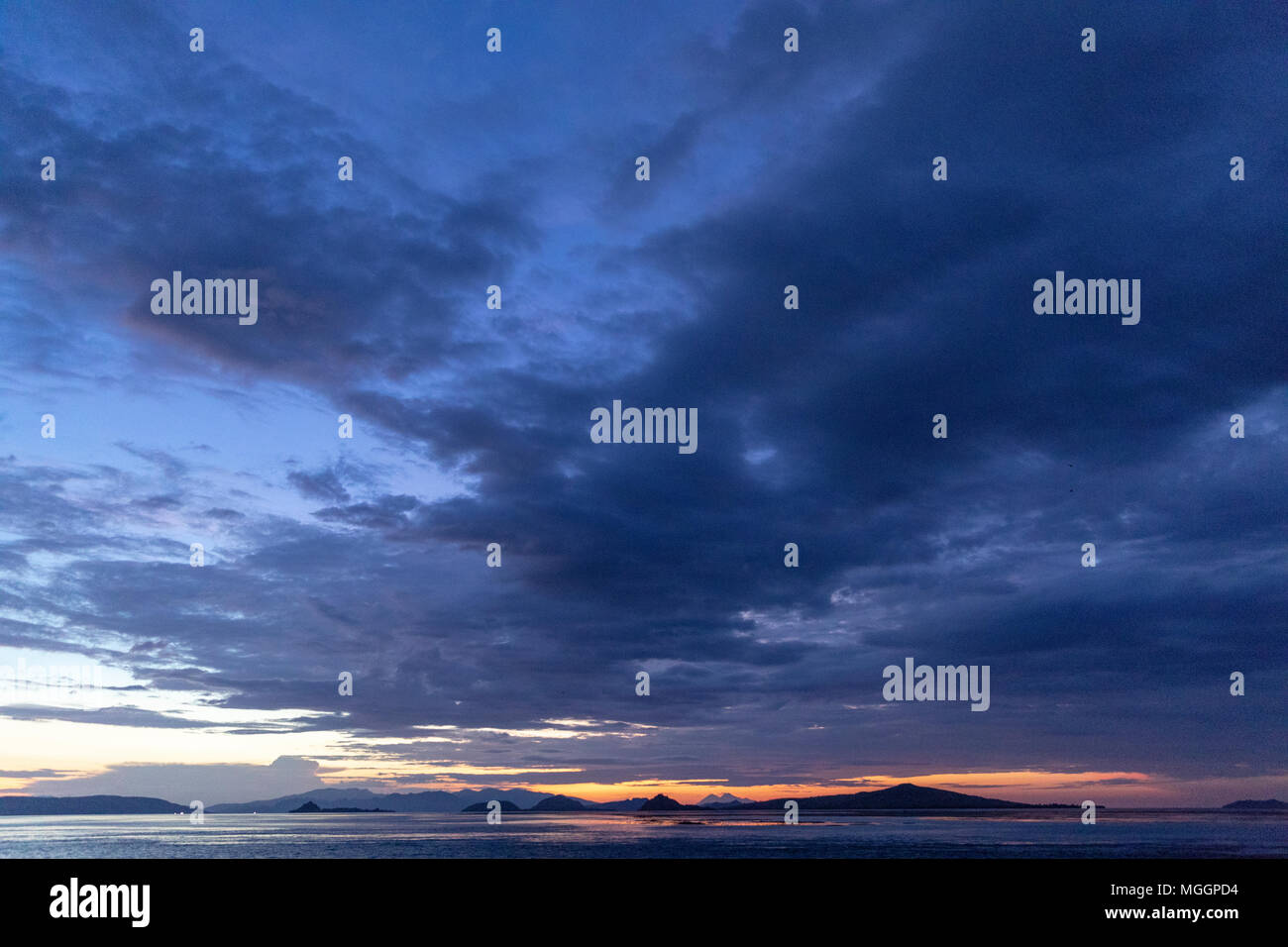 Sunset near Rinca Island in Komodo National Park, Indonesia Stock Photo ...