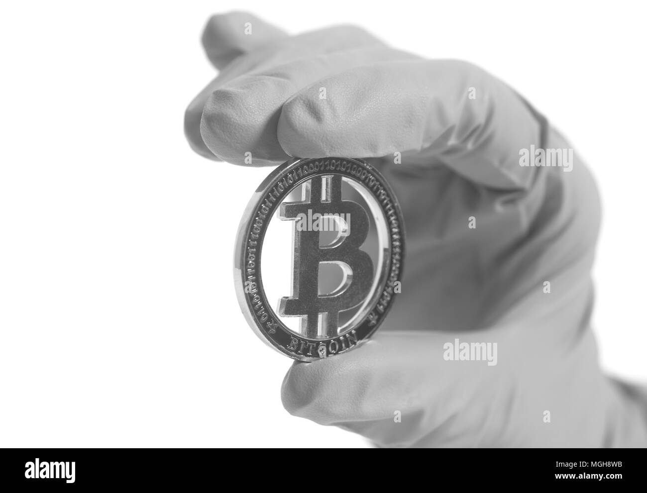 Hand in Gray Glove holds Bitcoin Crypto Currency isolated on a white ...