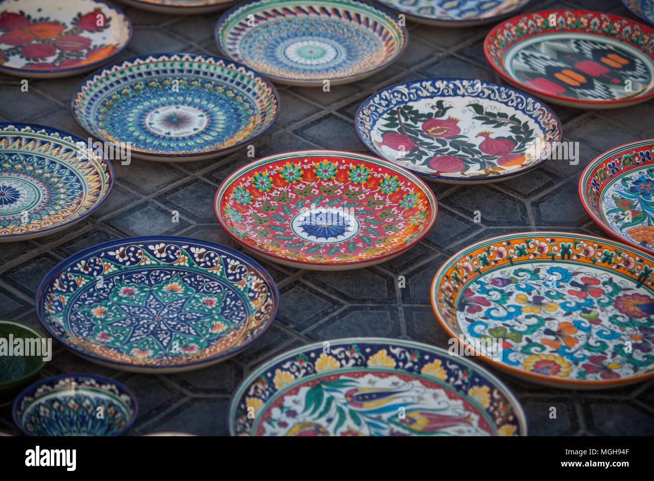 Color image of some handmade Uzbekistan plates for sale Stock Photo - Alamy