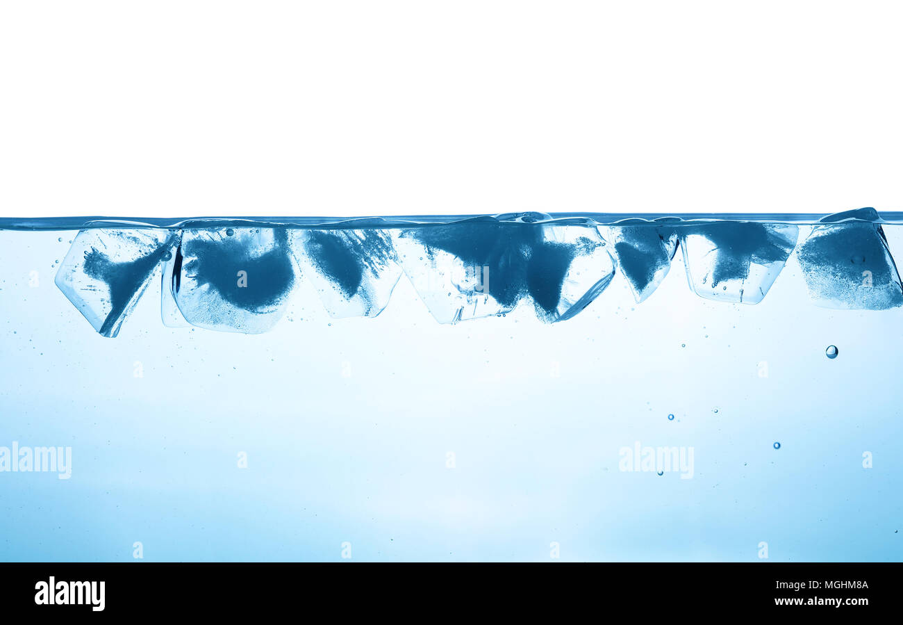 Close up water surface with ice cubes isolated on white background, low ...