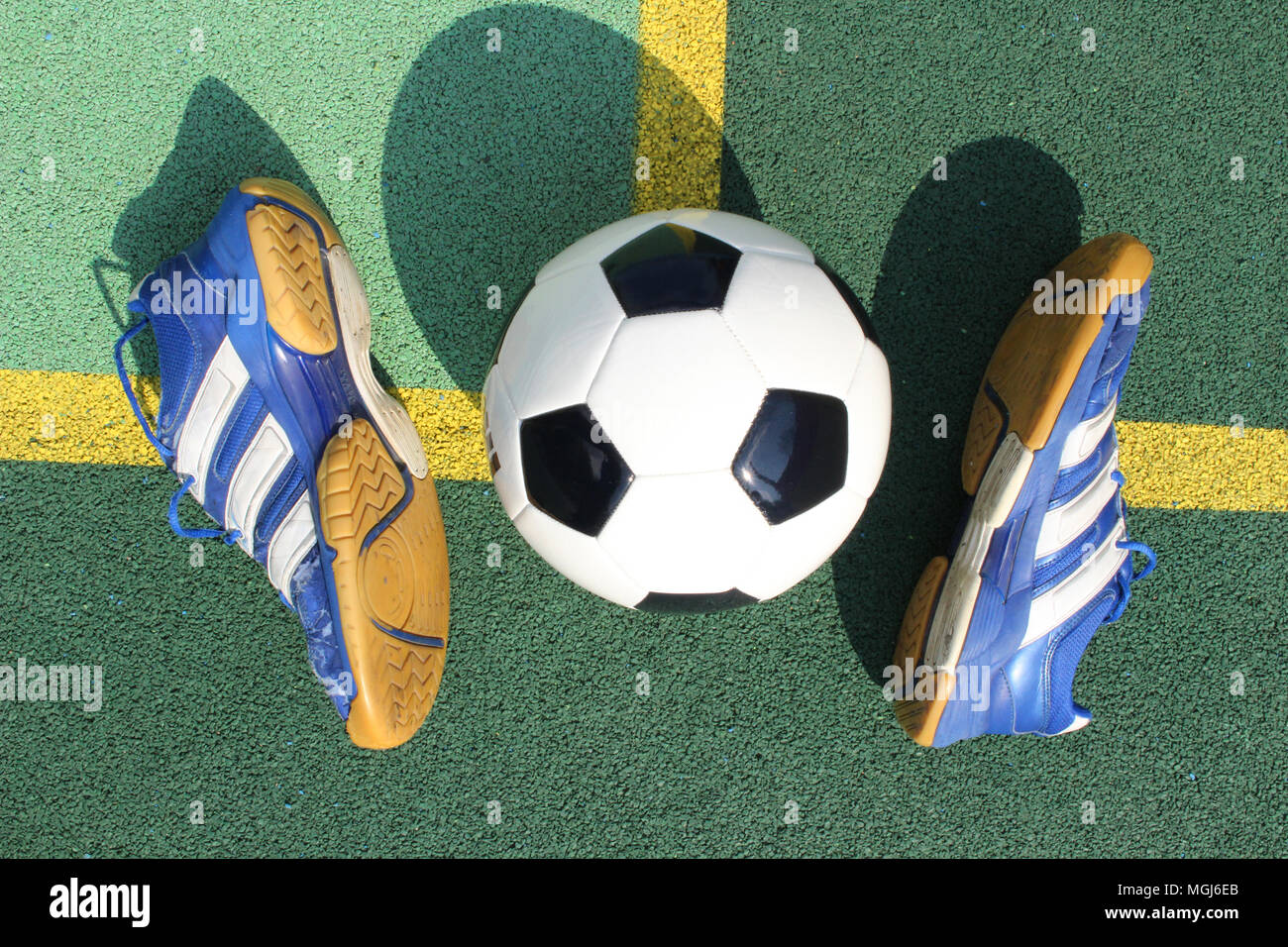 Soccer ball on a playing field Stock Photo - Alamy