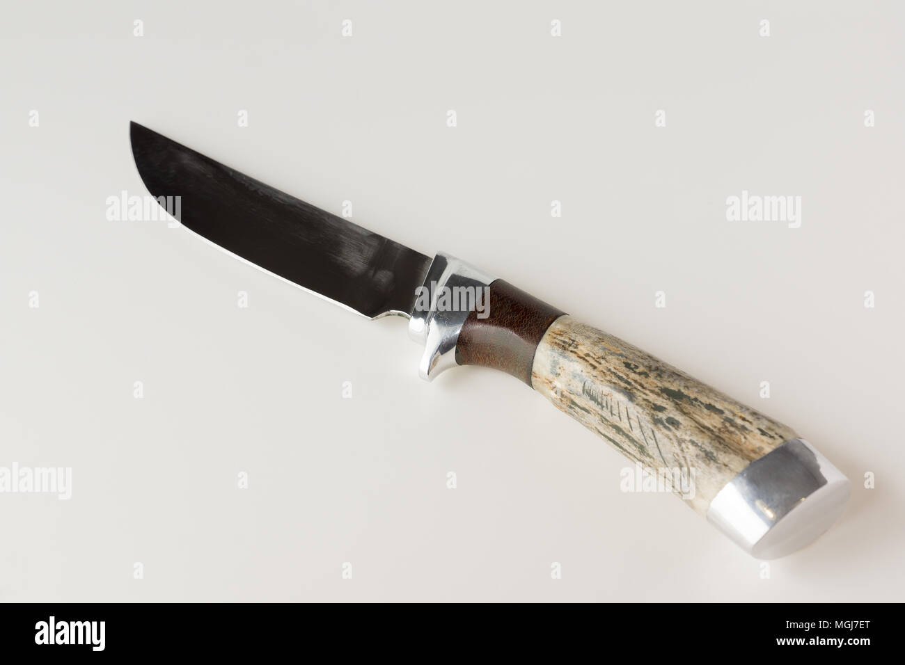 Hunting knife with bone handle isolated on white background Stock Photo ...