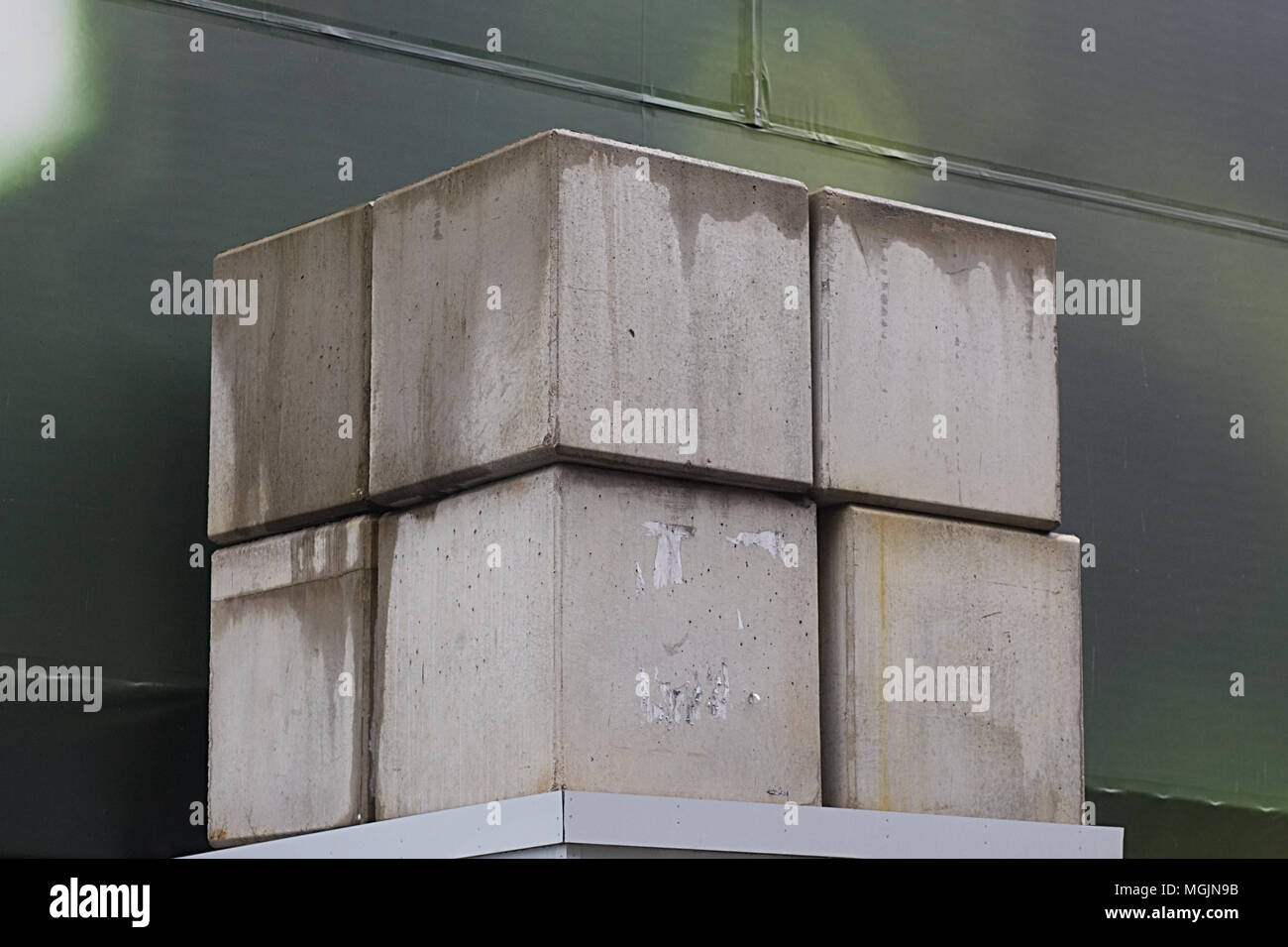 modern artwork, 8 square blocks made from concrete Stock Photo - Alamy