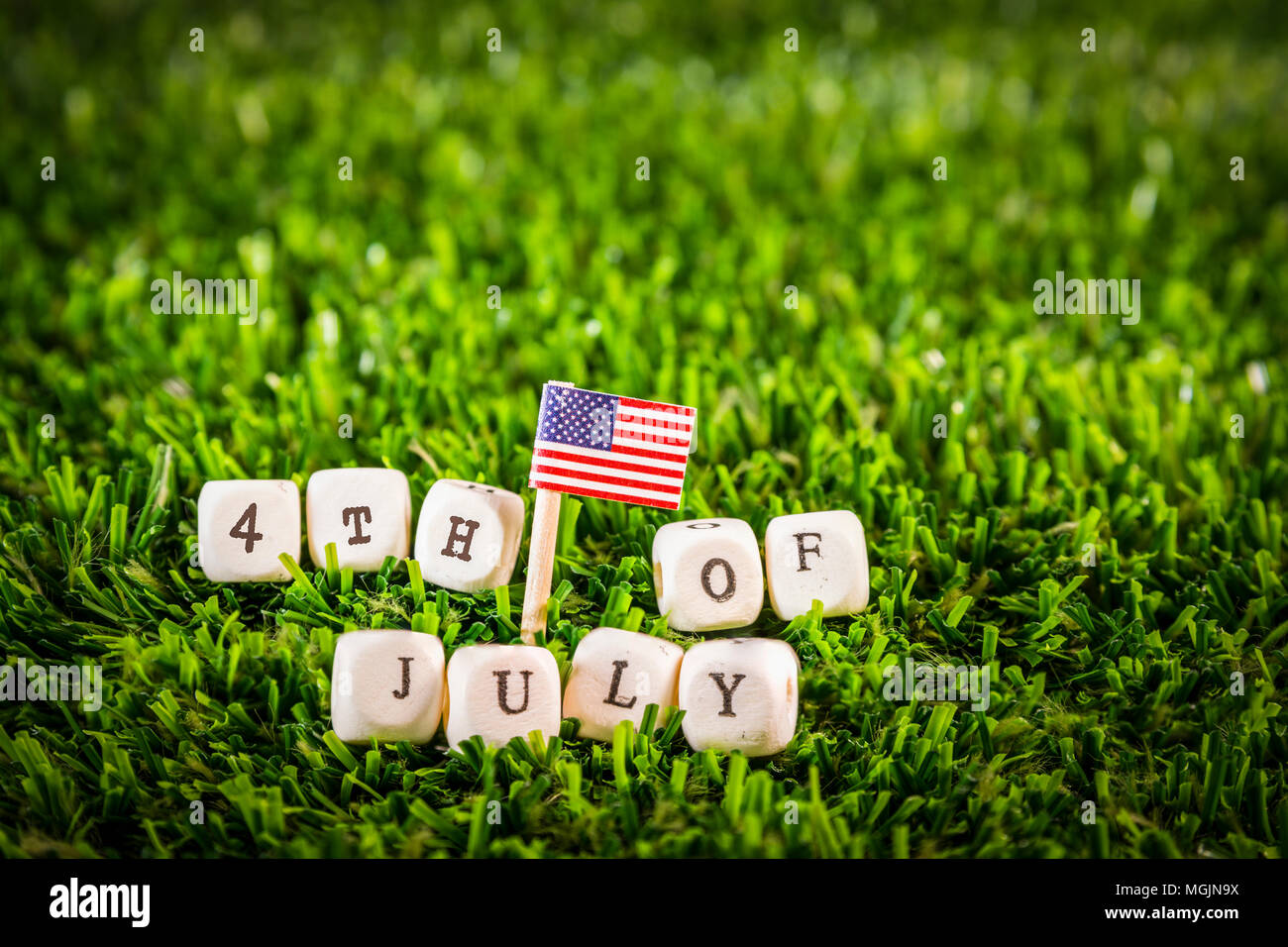 4th of July word and american flag Stock Photo - Alamy