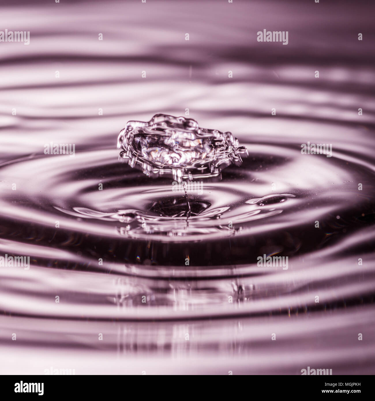 Two water drops collide and provide a collision Stock Photo - Alamy
