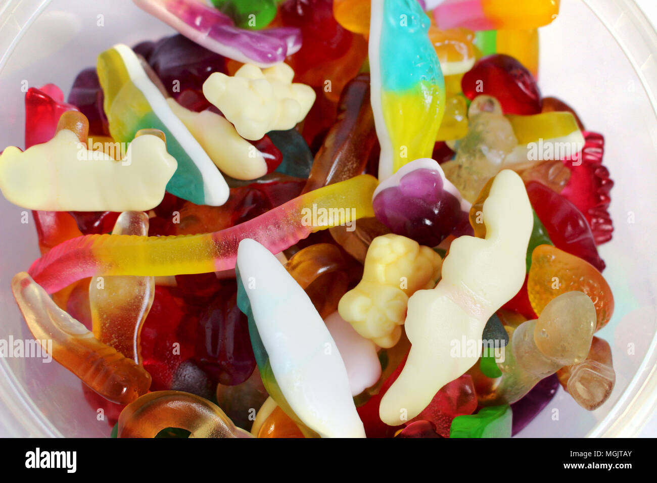 Gummy candies in a see through round box Stock Photo - Alamy