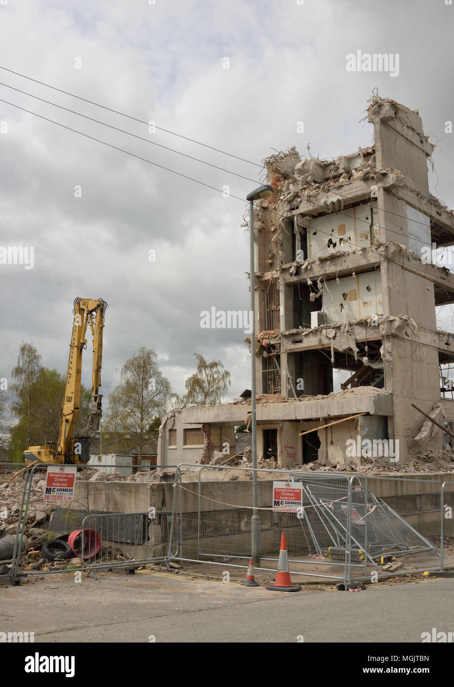 Controlled demolition of reinforced concrete multi storey building with ...