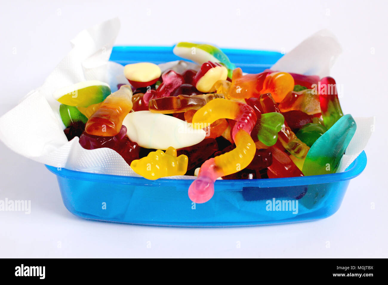 Gummy candies in a blue lunch box Stock Photo - Alamy