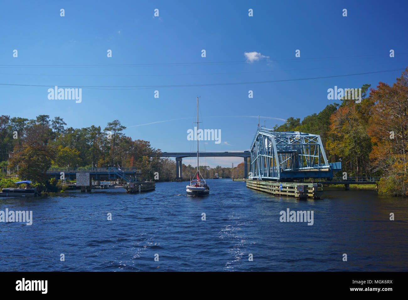 Intracoastal Waterway, United States - a sailboat motors through an ...
