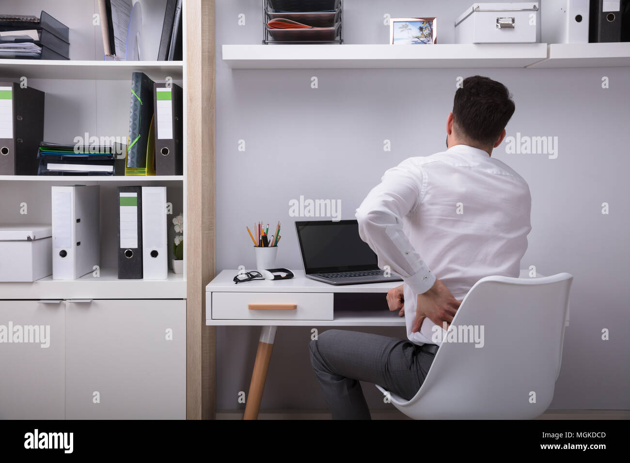 Rear View Of A Businessman Suffering From Back Pain At Workplace Stock ...